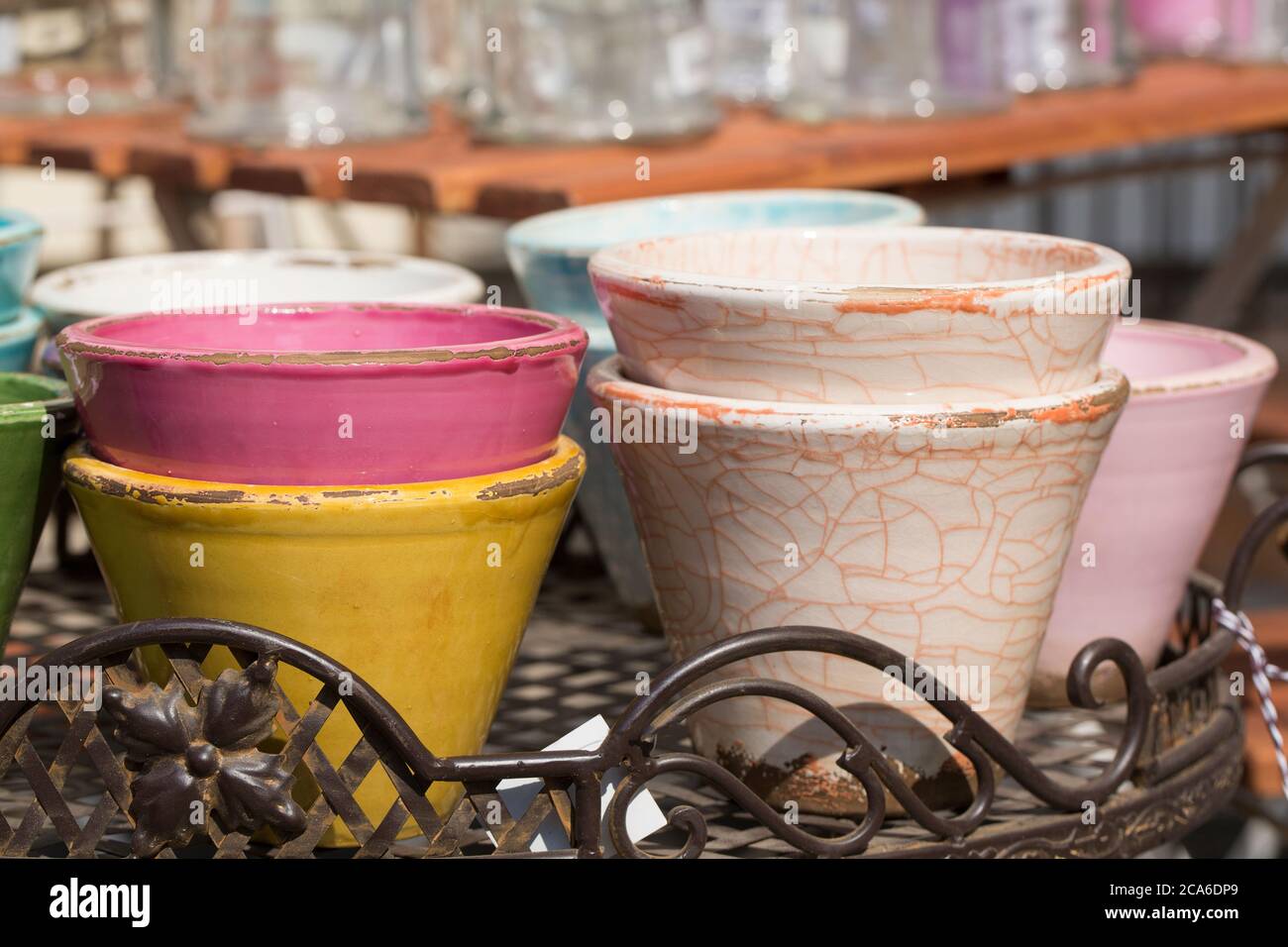 Rustic retro ceramic flower pots in various colors Stock Photo - Alamy