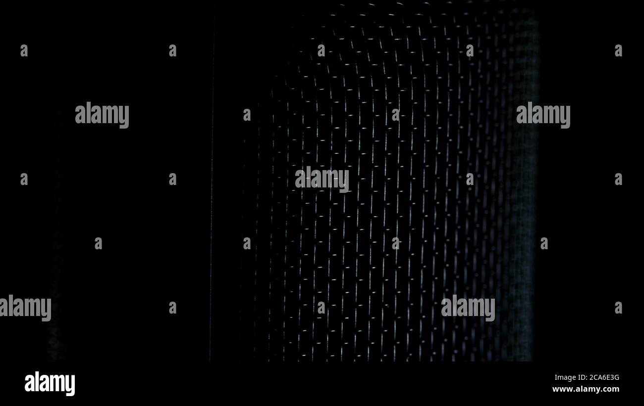 Microphone grid surface. Extreme close-up footage of mike head rotating ...