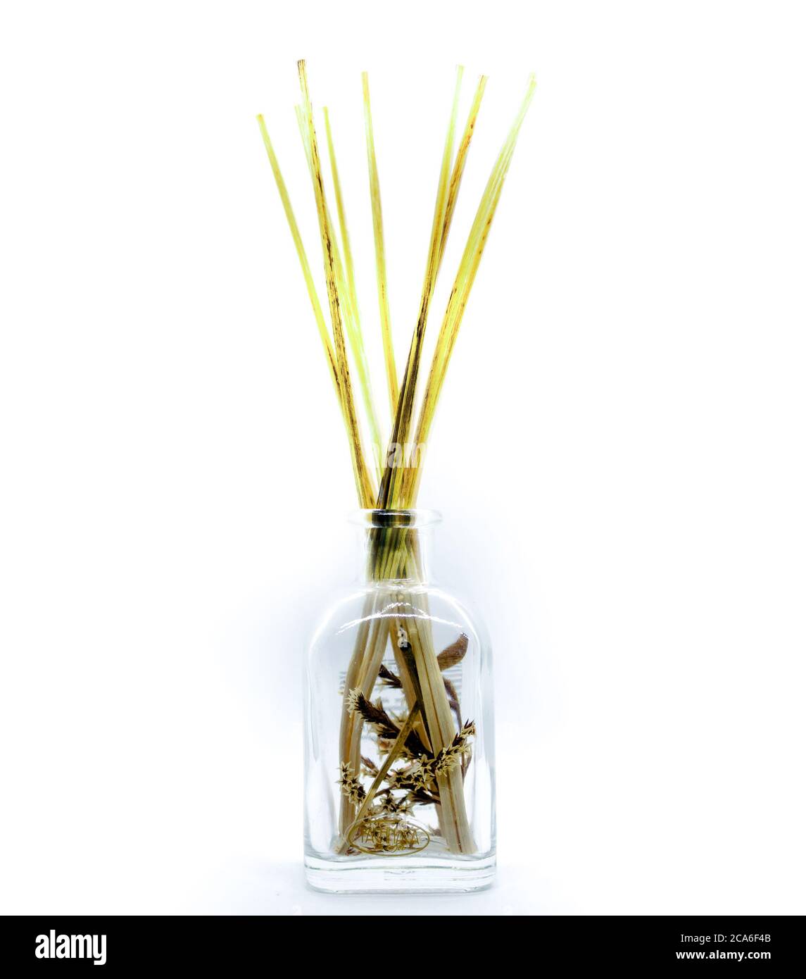 Close up of an object with wood sticks in liquid for home fragrance or ...