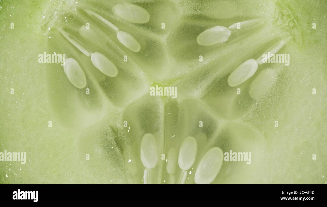 Macro view of cucumber slice. Rotative, abstract background. Extreme ...