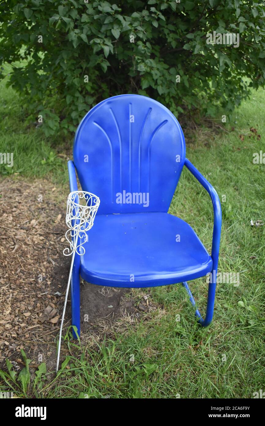 Blue Lawn Chair in a Yard Stock Photo - Alamy