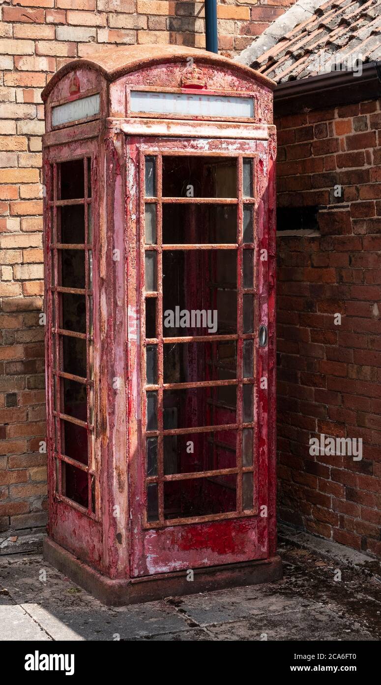 Old red telephone box being restored Stock Photo - Alamy
