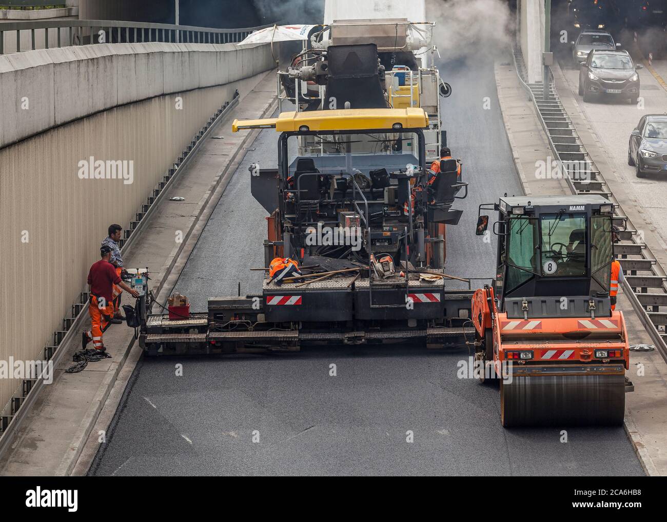 Roadworks, application of new asphalt on german highway Stock Photo - Alamy