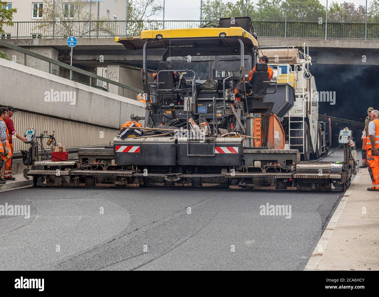 Roadworks, application of new asphalt on german highway Stock Photo - Alamy