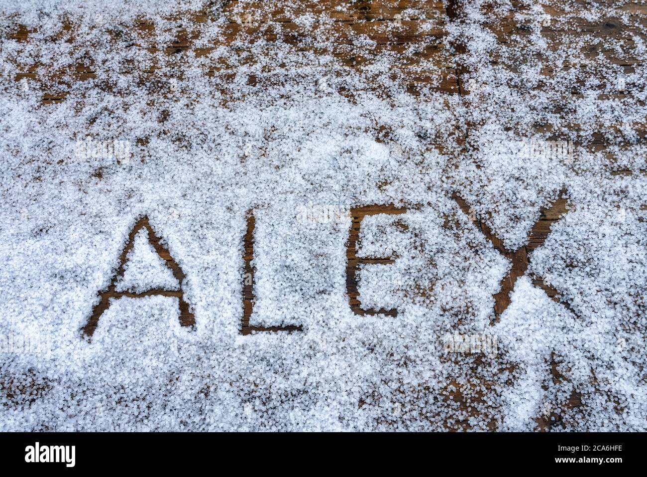 Close up at name Alex which is written is in capital letters on hail ...