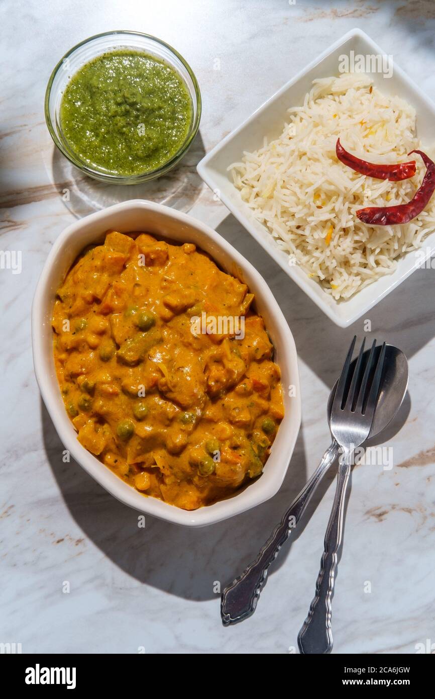 Authentic Indian vegetable korma curry dinner with green chutney and ...