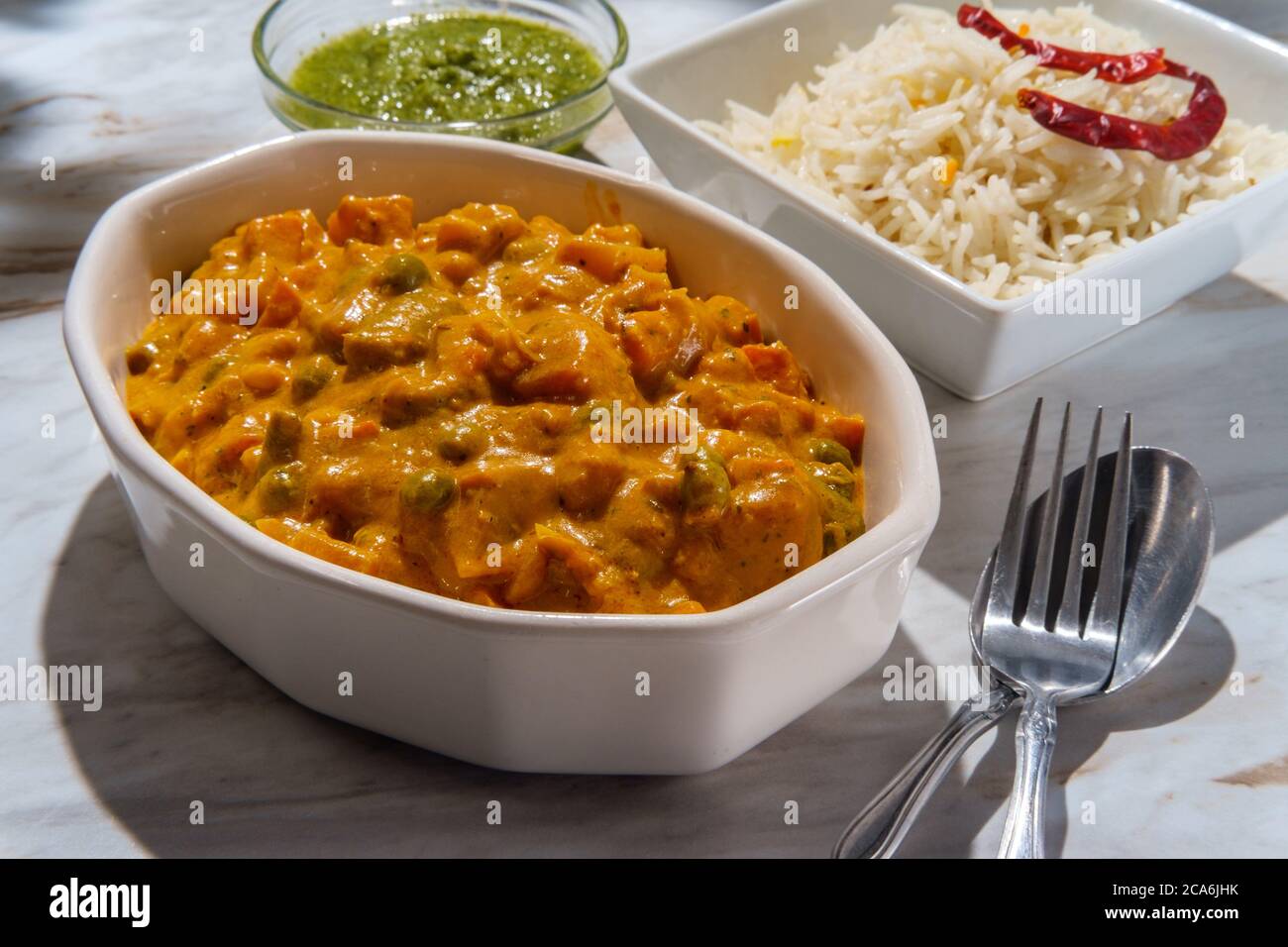 Authentic Indian vegetable korma curry dinner with green chutney and ...