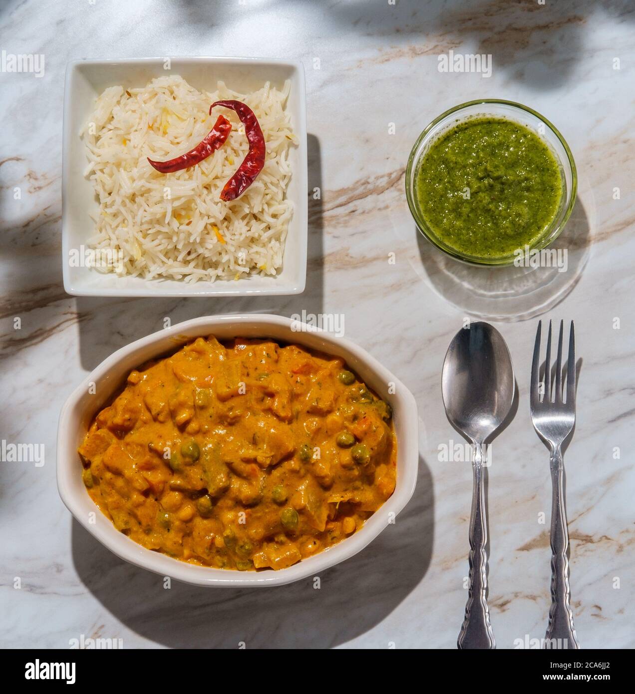 Authentic Indian vegetable korma curry dinner with green chutney and ...