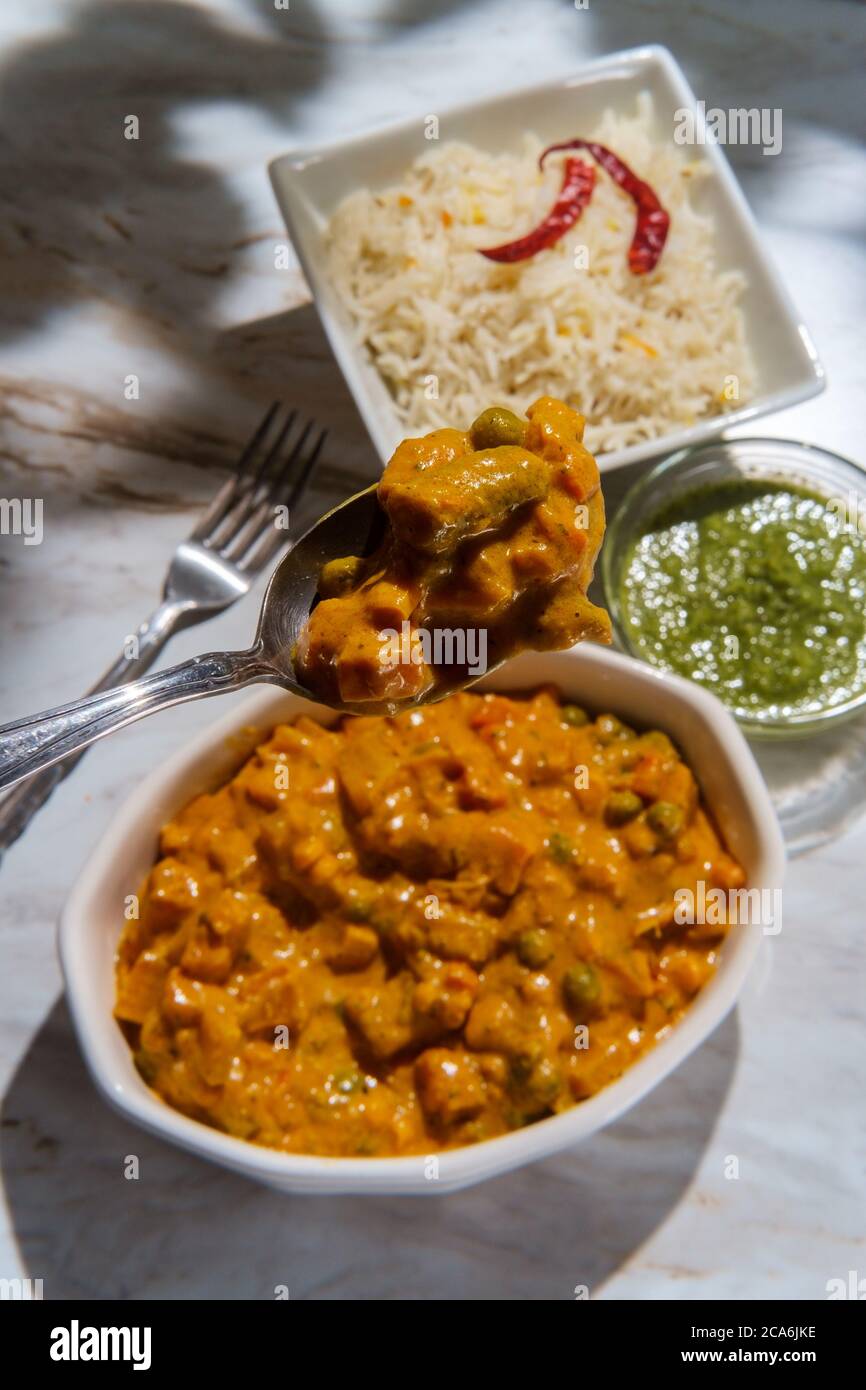 Authentic Indian vegetable korma curry dinner with green chutney and ...