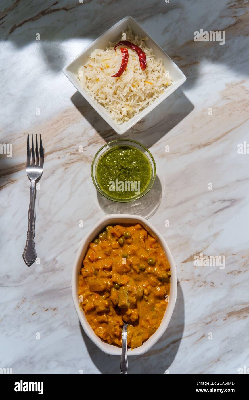 Authentic Indian vegetable korma curry dinner with green chutney and ...