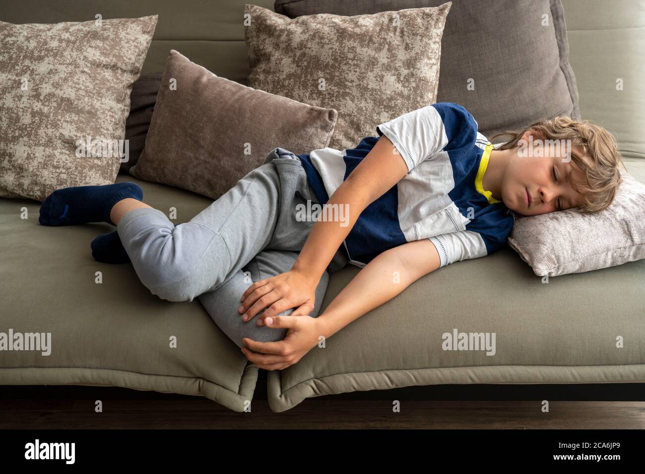 Growth pain in children, boy, 10 years old, has pain in the leg ...