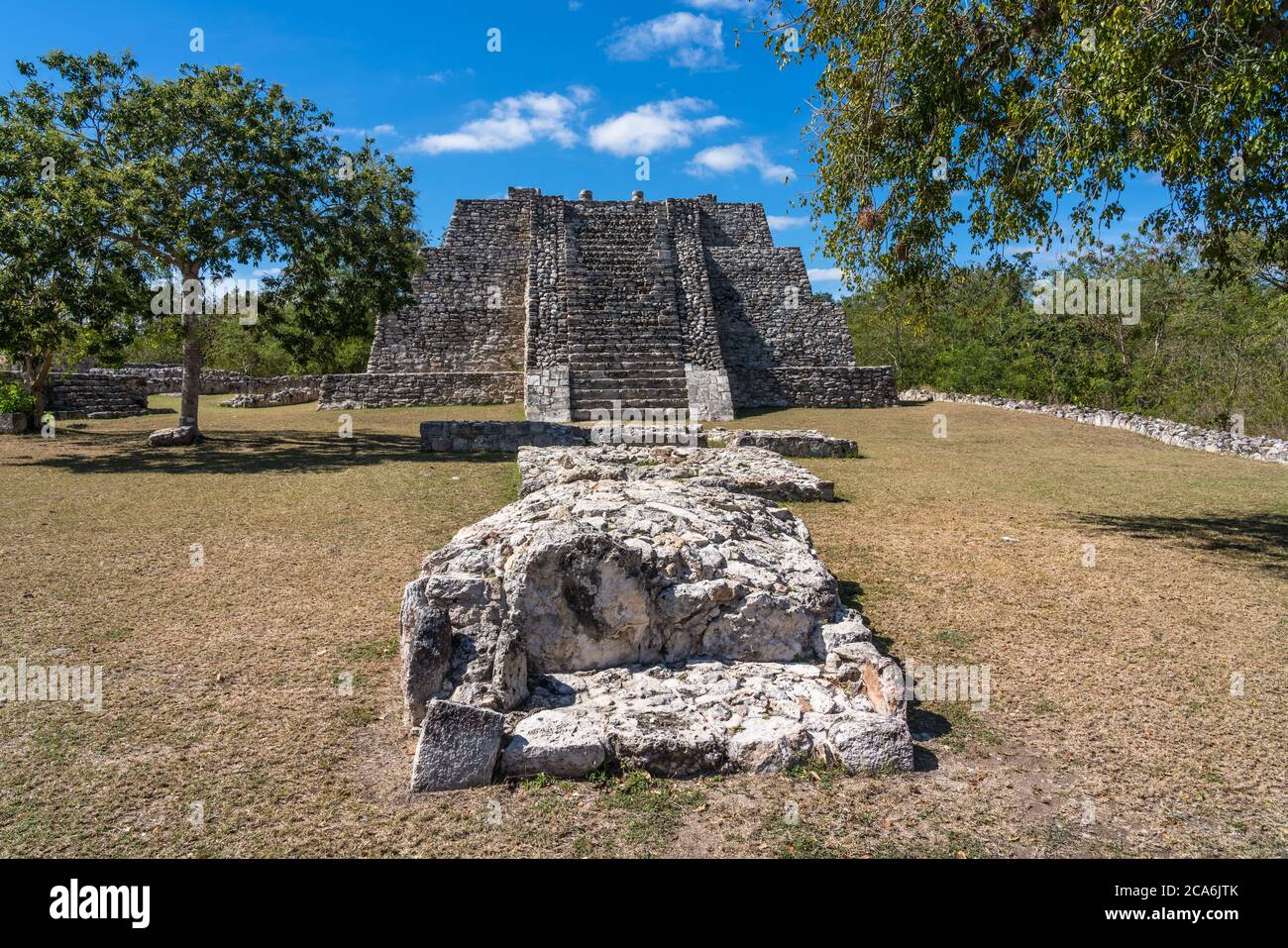 A altar and a stepped pyramid in the ruins of the Post-Classic Mayan ...