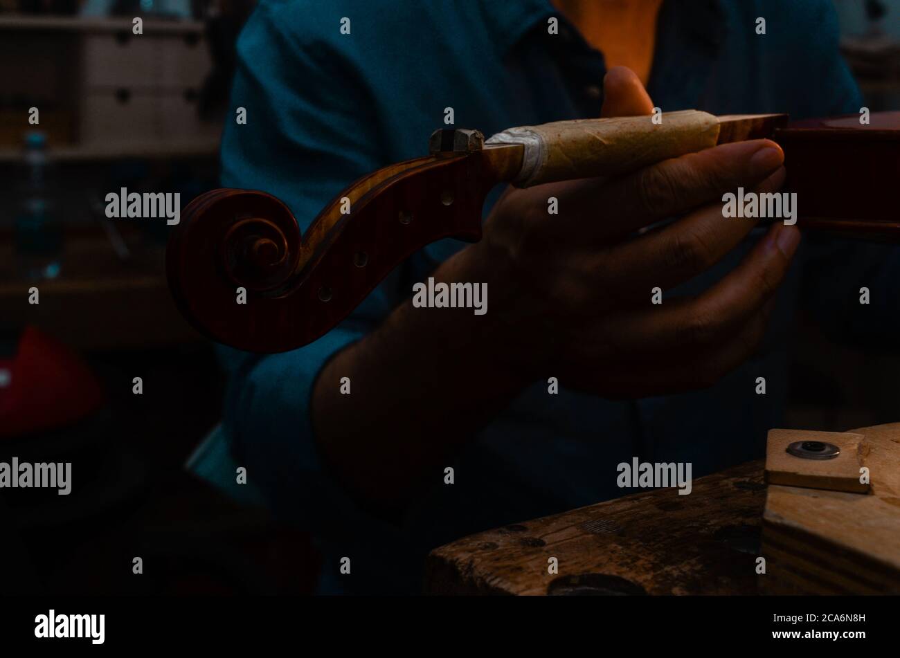 Luthier violin maker artisan setting up a violin in his workshop Stock ...
