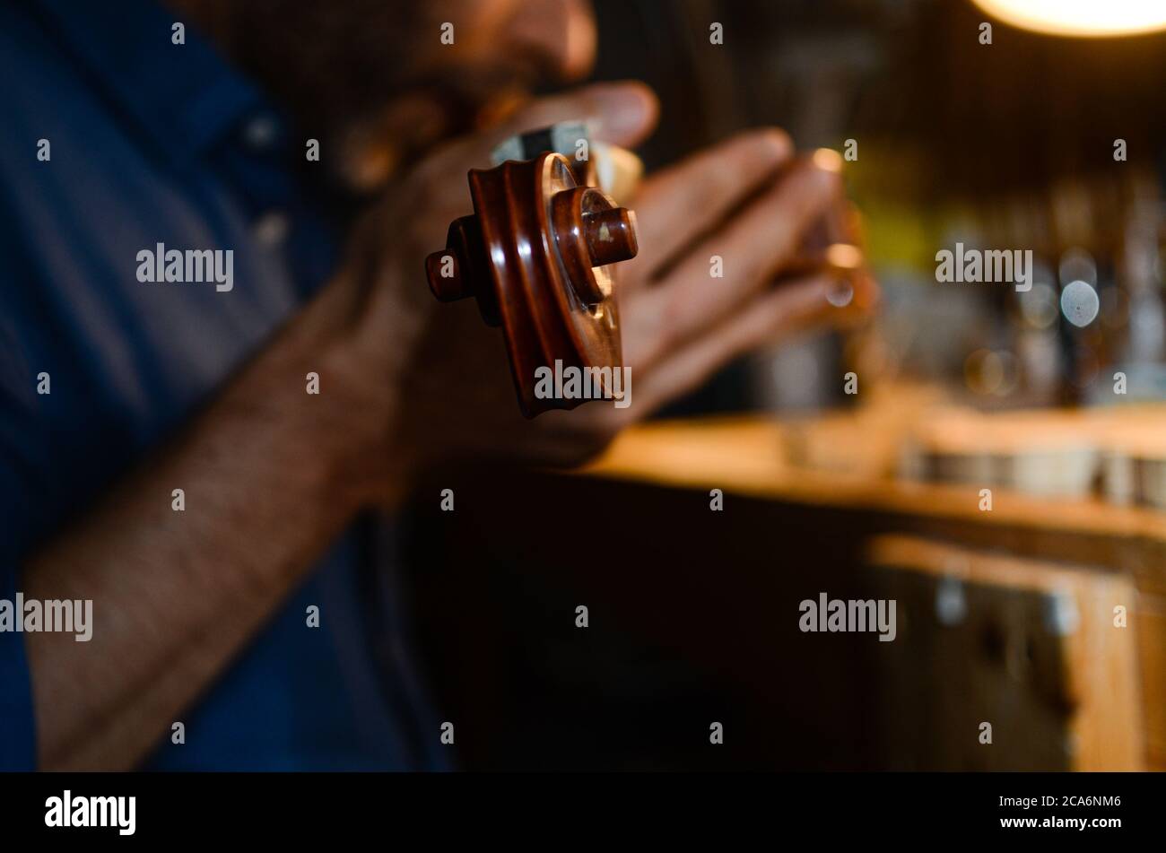 Luthier violin maker artisan setting up a violin in his workshop Stock ...