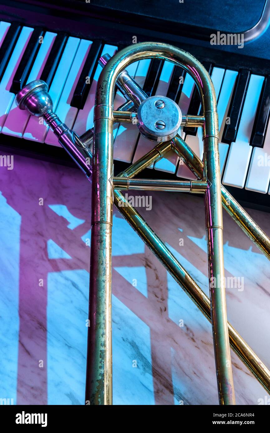 Old and worn Jazz slide trombone and piano keyboard musical show and ...