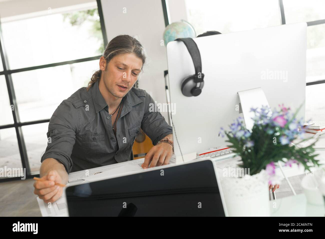 Handsome guy at computer work Stock Photo - Alamy