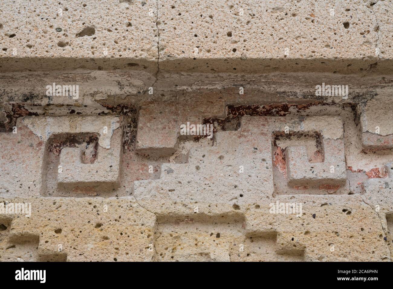 Detail of a stone fretwork frieze with remnants of the original paint ...