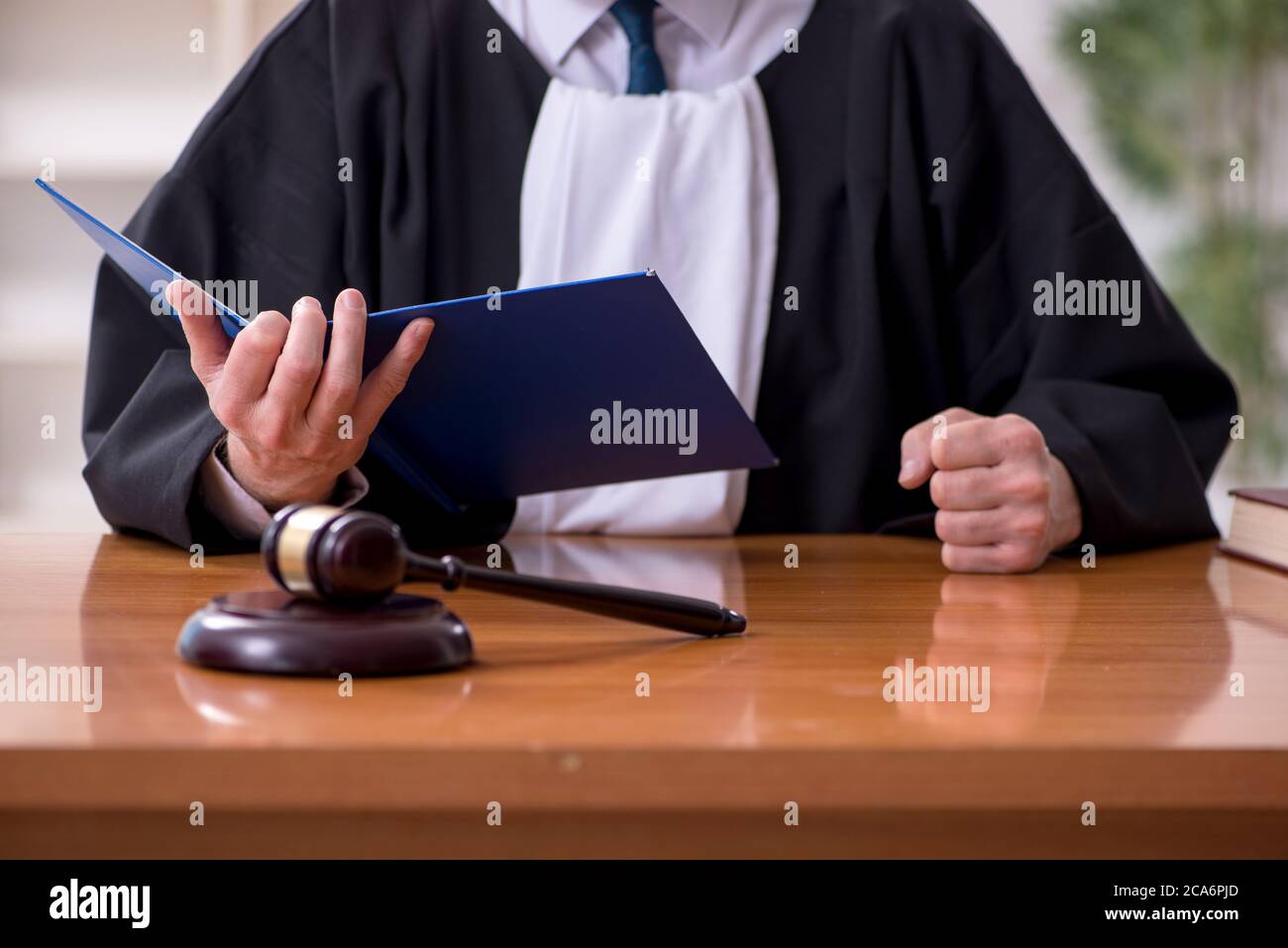 Old judge working in courthouse Stock Photo - Alamy