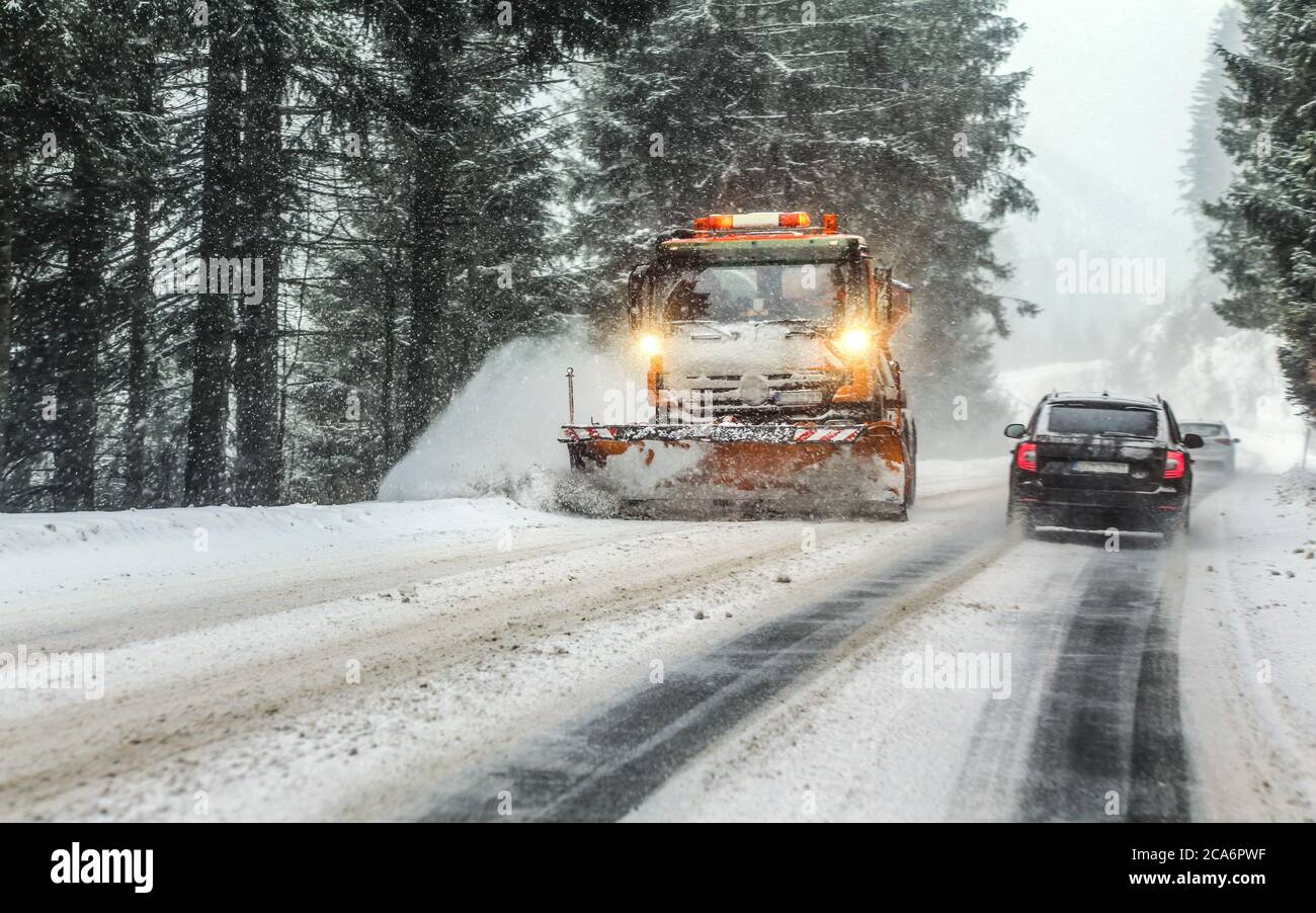 Orange snowplow on highway hi-res stock photography and images - Alamy