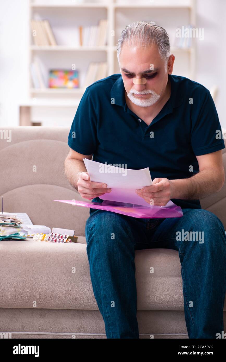 Old man in budget planning concept Stock Photo - Alamy