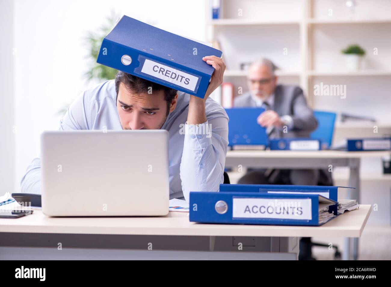 The two accountants working in the office Stock Photo - Alamy