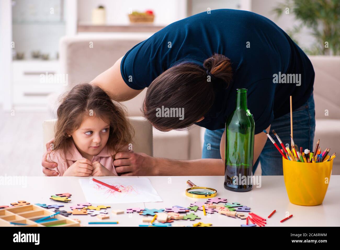 Drunk father and little girl at home Stock Photo - Alamy
