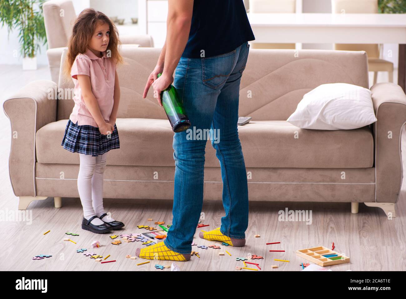 Drunk father and little girl at home Stock Photo - Alamy