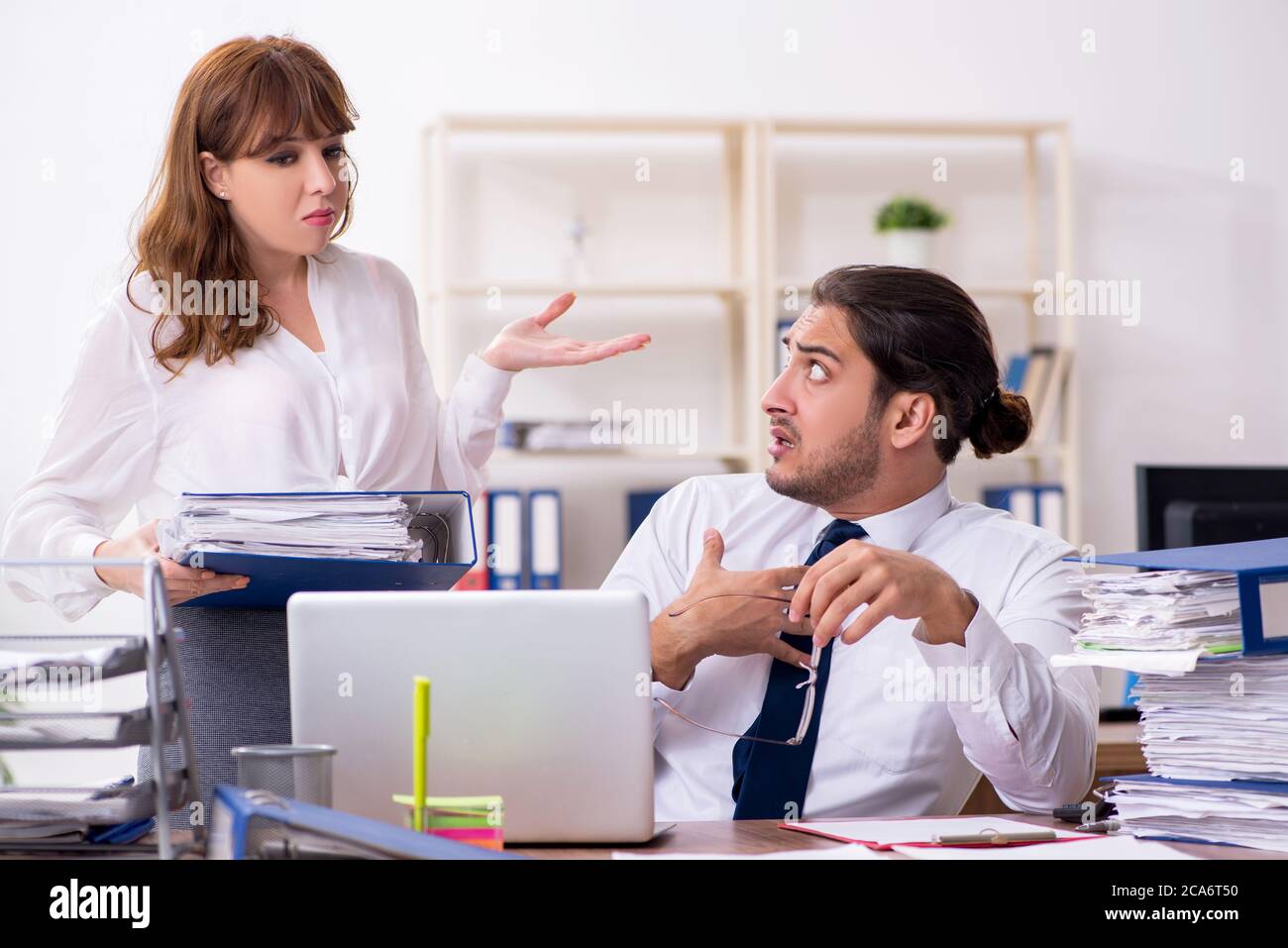 Two employees working in the office environment Stock Photo - Alamy