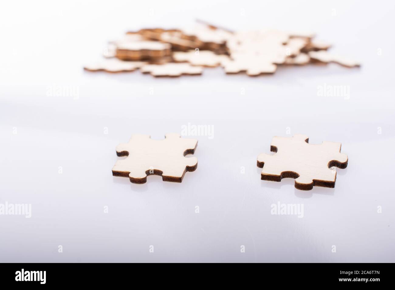 Pieces of jigsaw puzzle as problem solution concept on white background ...