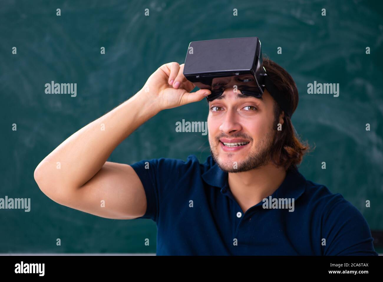 Young scientist sitting in the classroom Stock Photo - Alamy