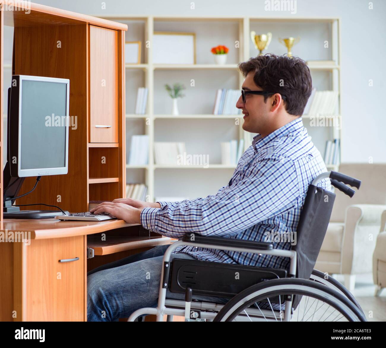 The disabled student studying at home on wheelchair Stock Photo - Alamy