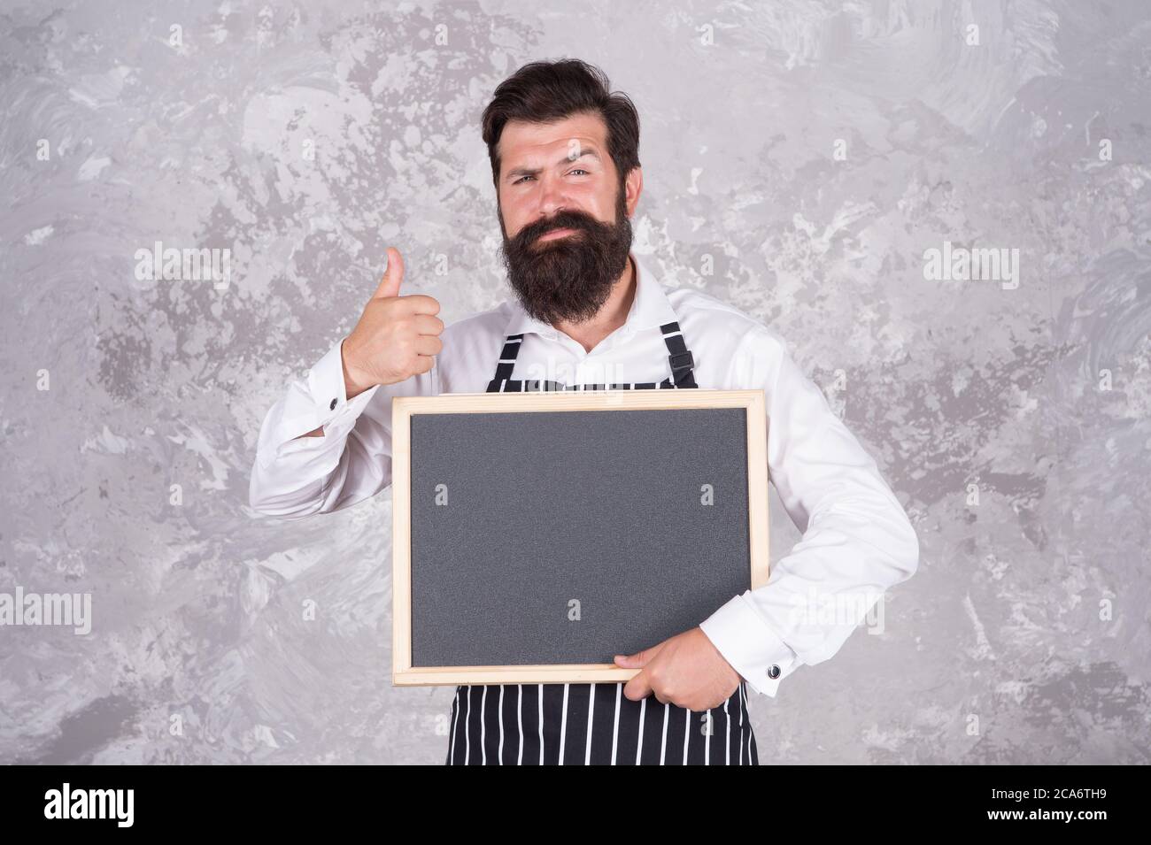 Man good looking hospitable restaurant waiter with blackboard copy ...