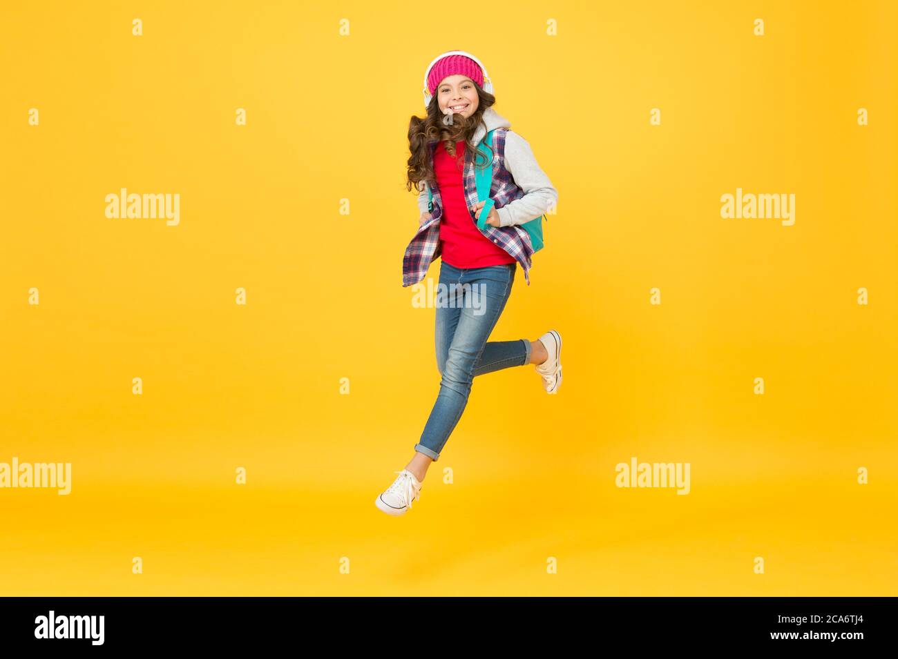 Life is a daring adventure. Happy child jump yellow background ...