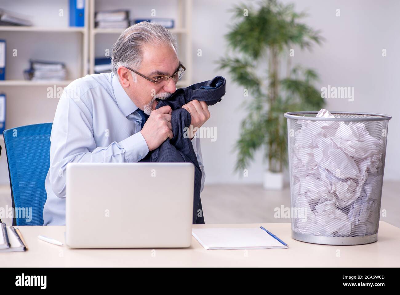 Old businessman rejecting ideas with lots of papers Stock Photo - Alamy