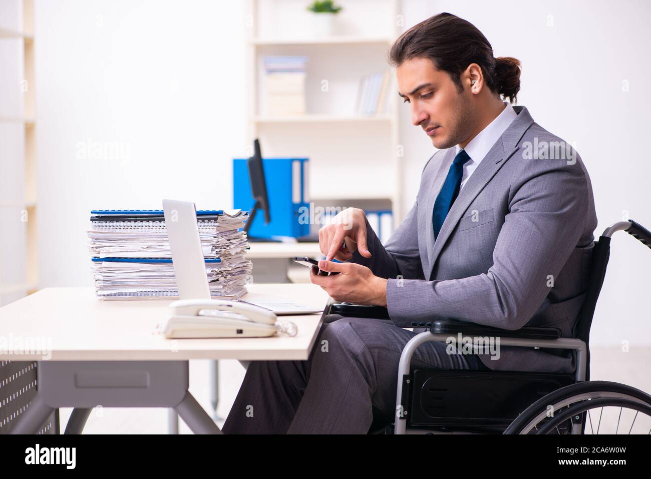 Disabled employee in the office environment Stock Photo - Alamy