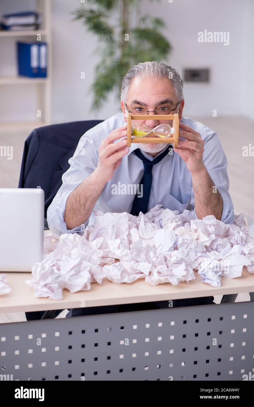 Old businessman rejecting ideas with lots of papers Stock Photo - Alamy