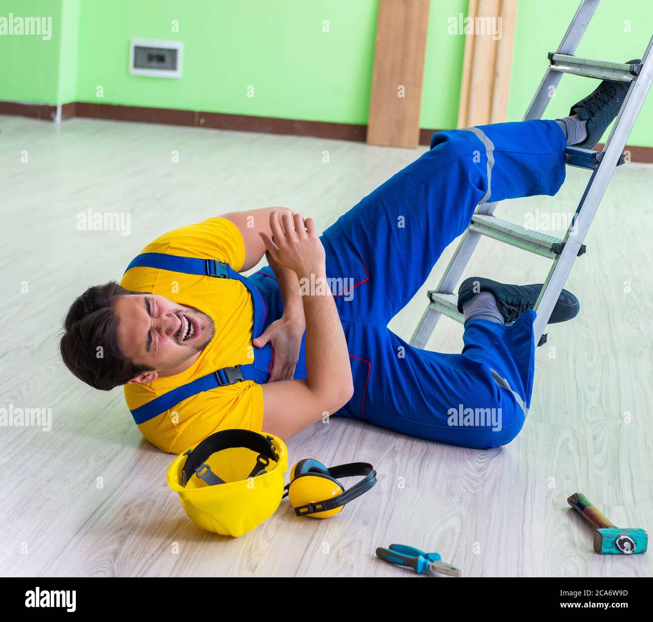 The injured worker at the work site Stock Photo - Alamy