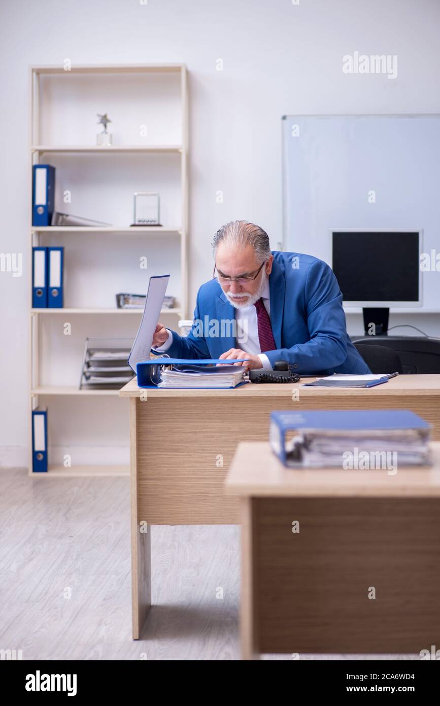 Male boss employee working in the office Stock Photo - Alamy
