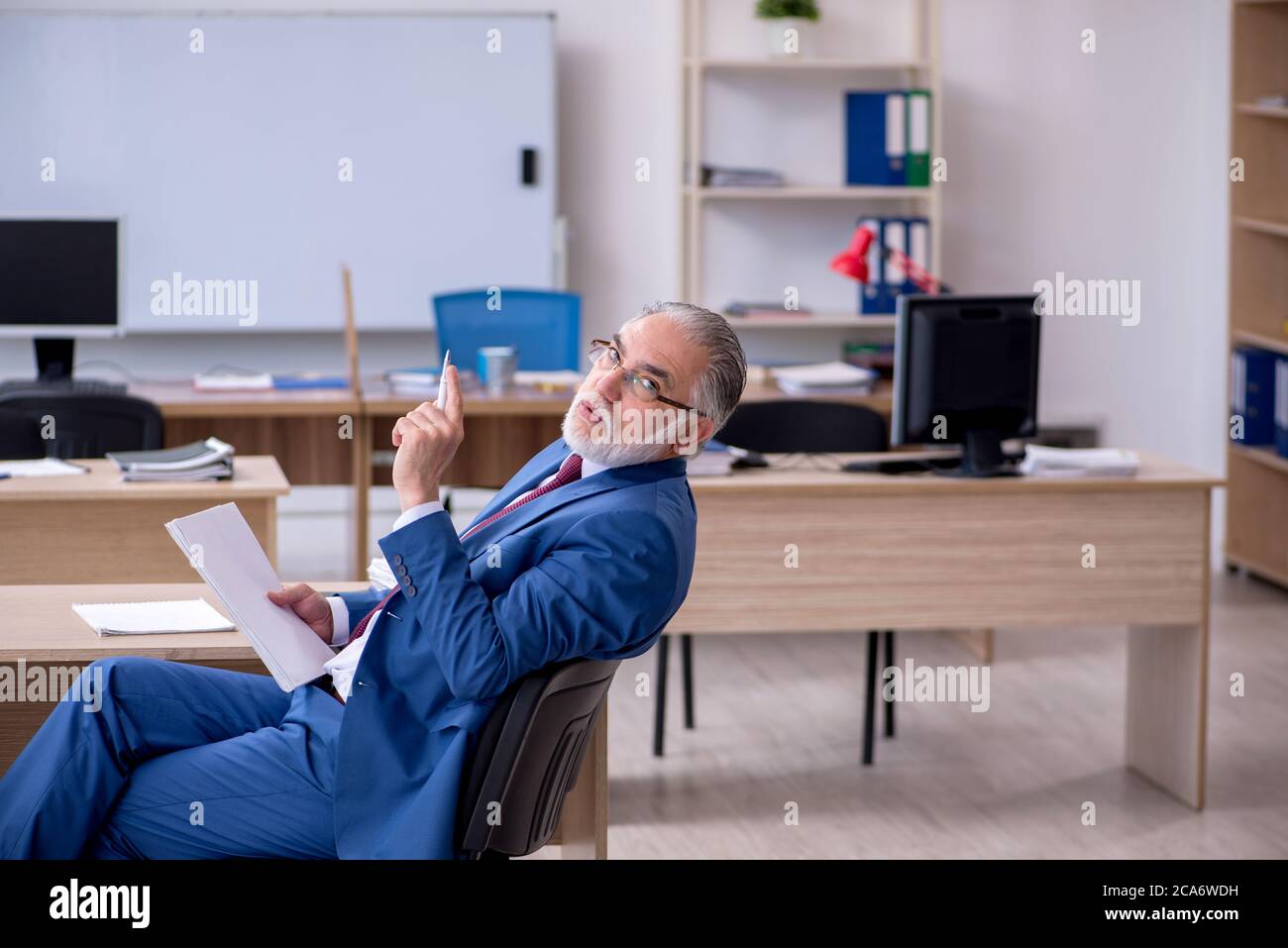 Male boss employee working in the office Stock Photo - Alamy