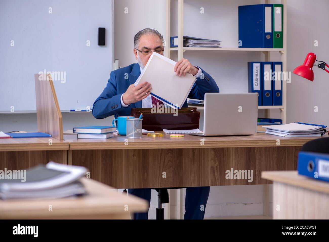 Male boss employee working in the office Stock Photo - Alamy
