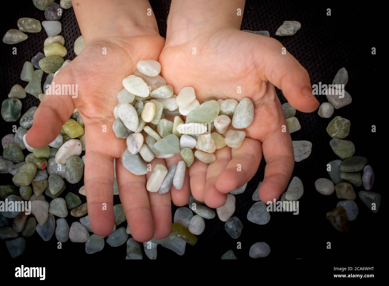 Sand stones hands closeup hi-res stock photography and images - Alamy