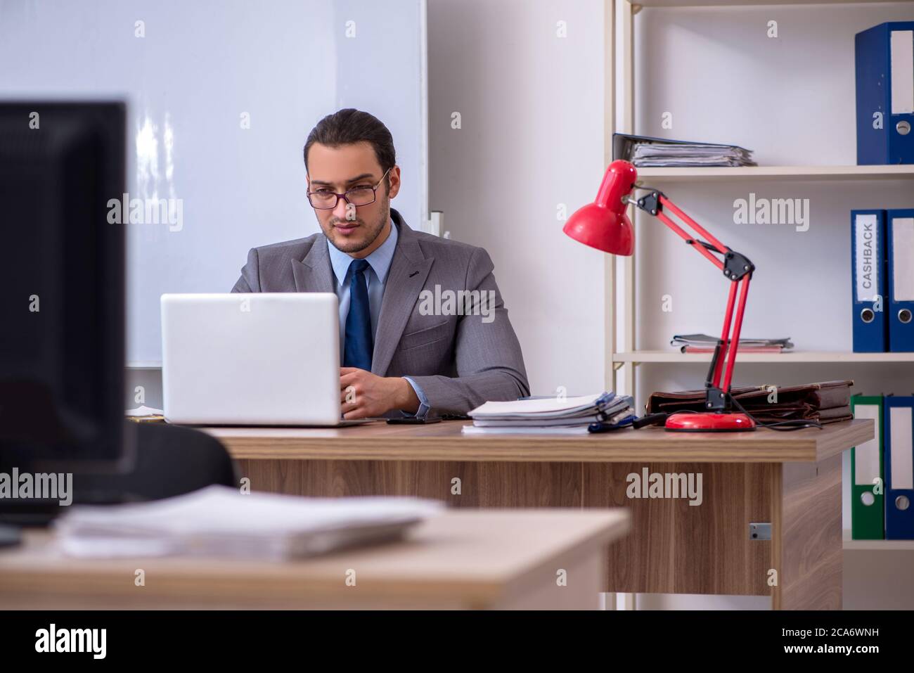 Male businessman employee working in the office Stock Photo - Alamy