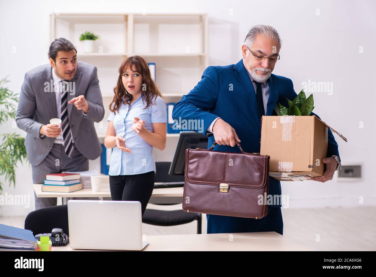Senior manager and three employees hi-res stock photography and images ...