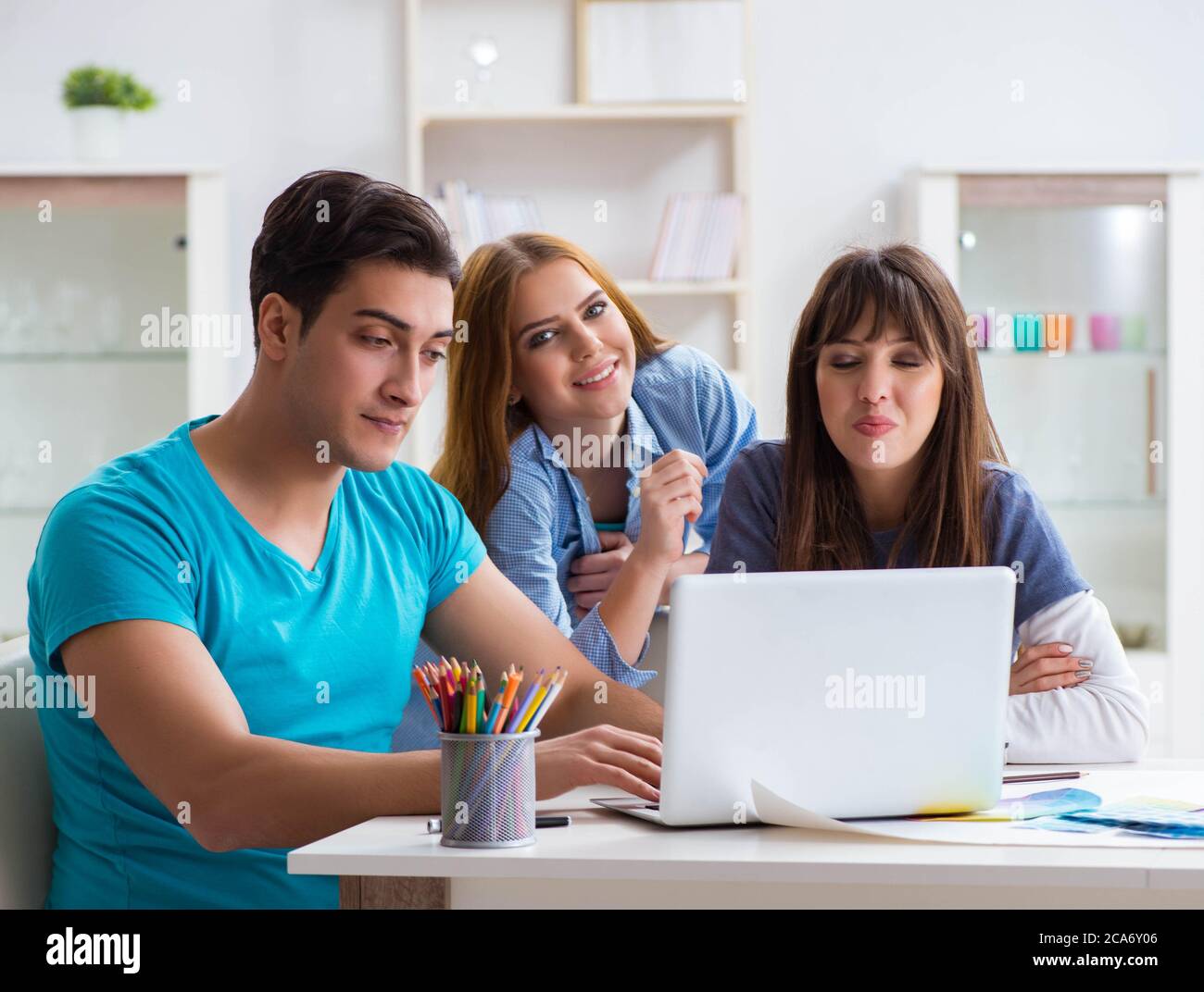 The team of designers discussing new interior project Stock Photo - Alamy