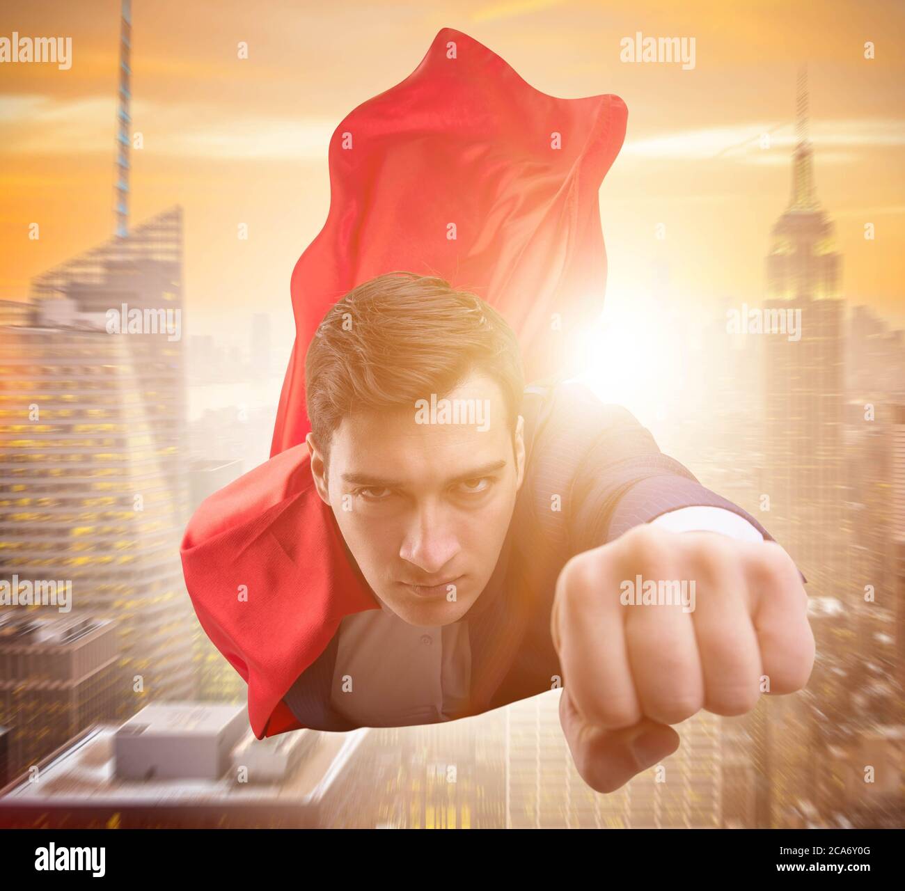 The flying super hero over the city Stock Photo - Alamy