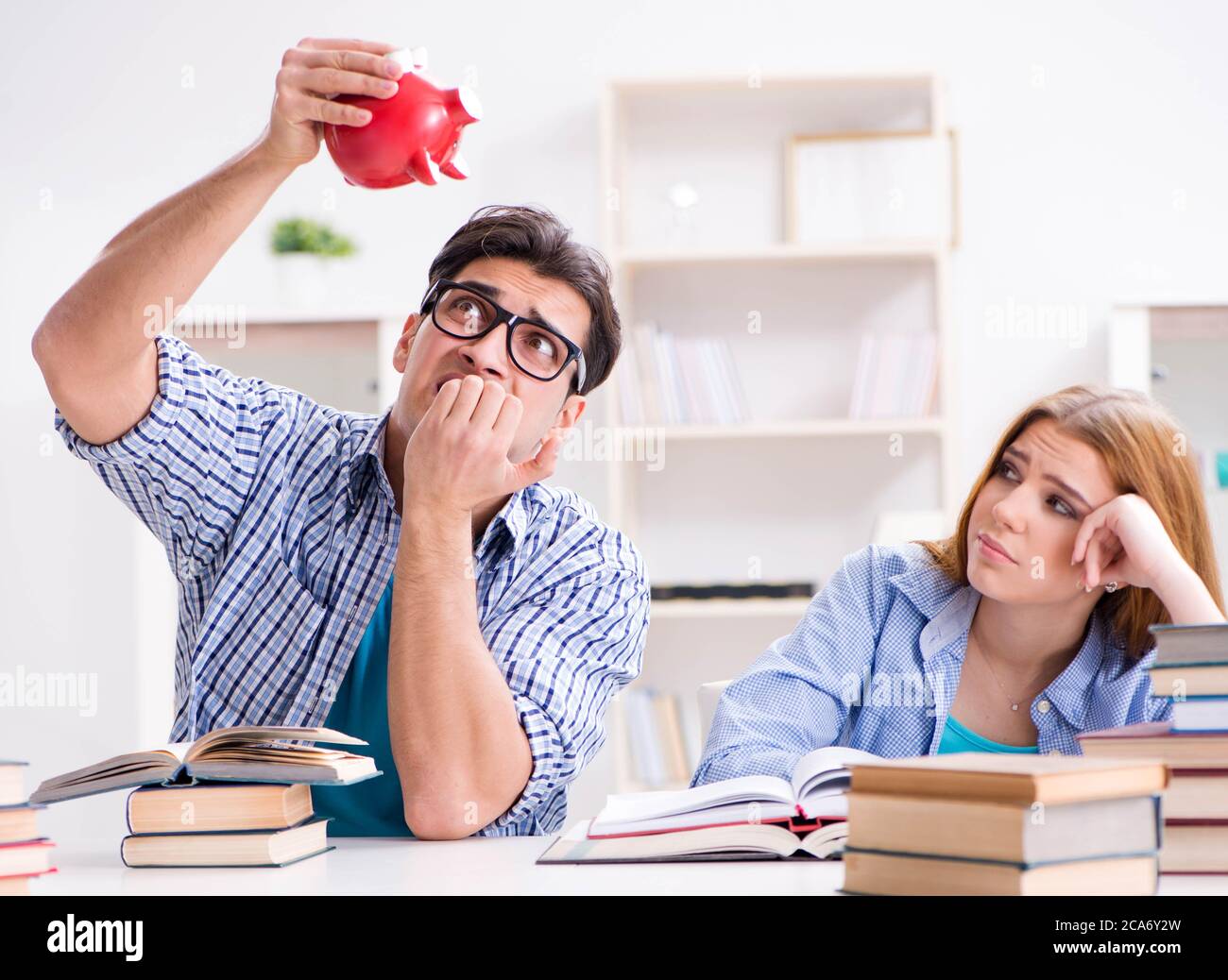 The two students checking savings to pay for education Stock Photo - Alamy