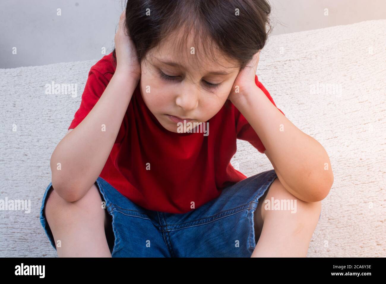 Emotional intelligence and thoughtfu boy looking lonely Stock Photo - Alamy