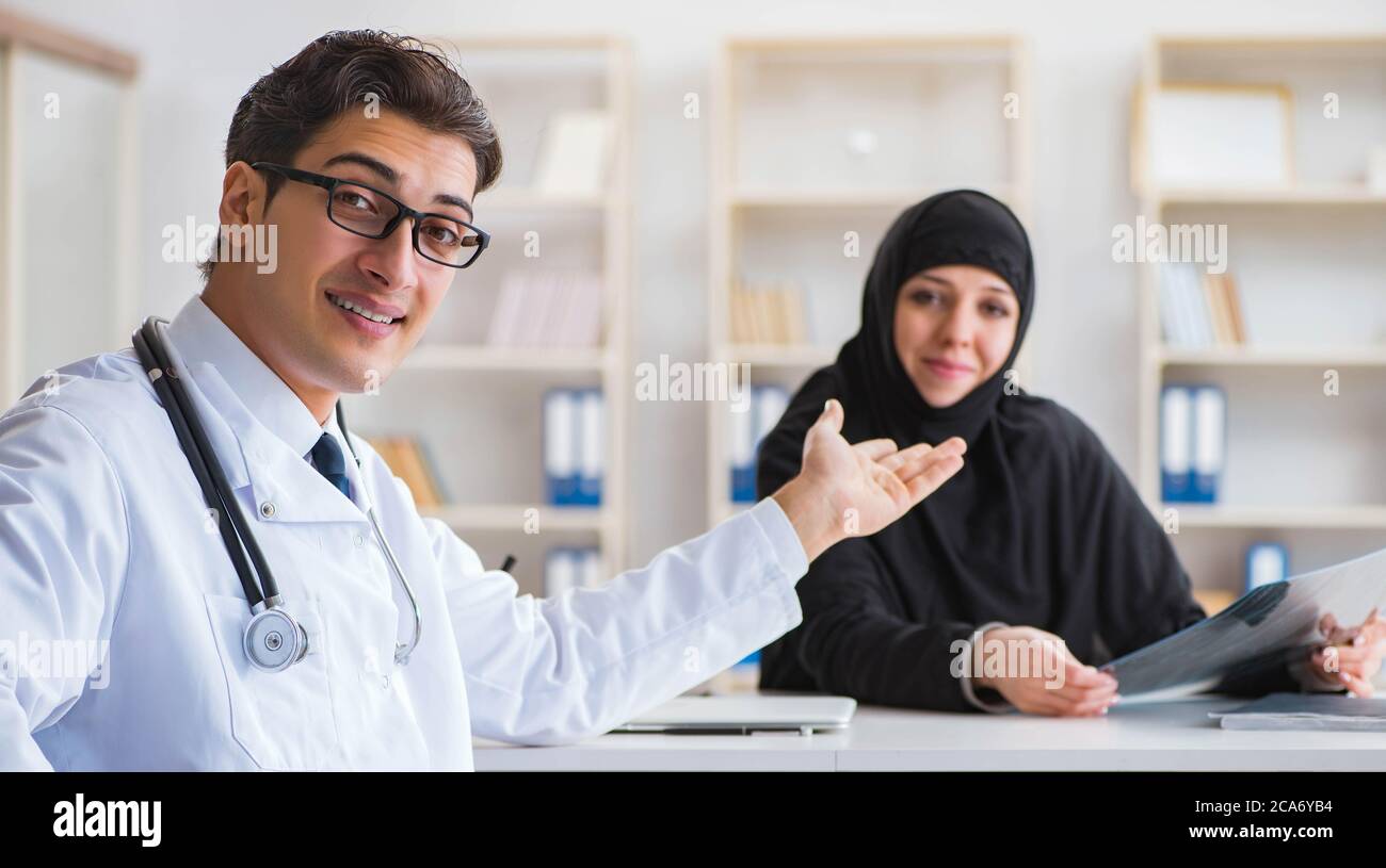 Muslim woman doctor examining patient hi-res stock photography and ...