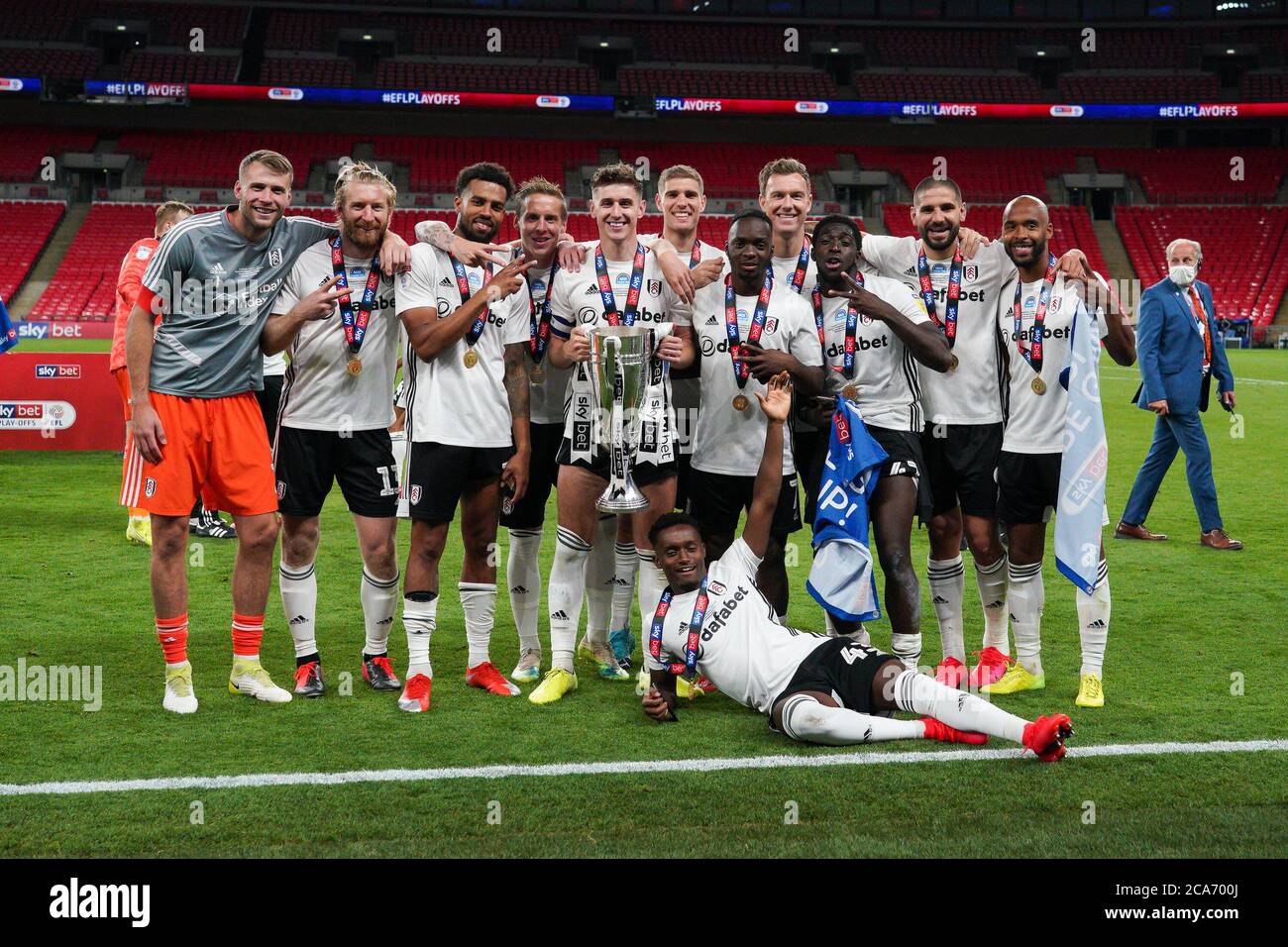 London, UK. 04th Aug, 2020. Fulham players celebrate with the trophy ...