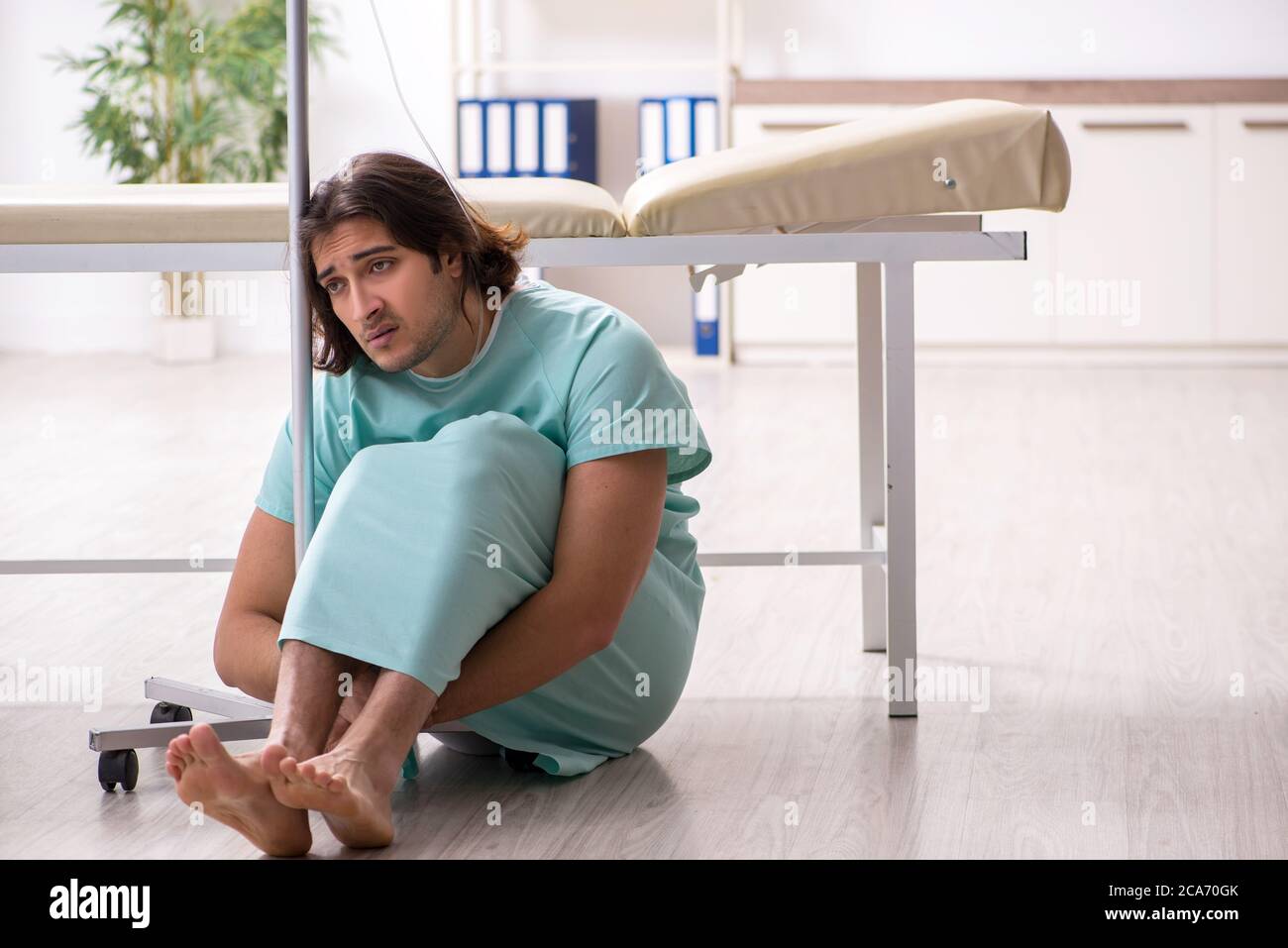 Young mad man in the hospital ward Stock Photo - Alamy